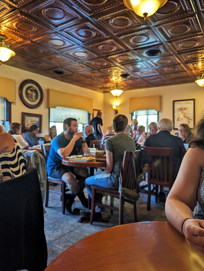 The dining room at peak happiness—a symphony of clinking glasses, satisfied murmurs, and the occasional gasp when dessert arrives.