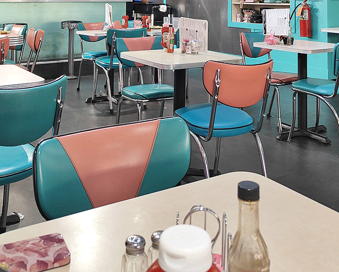 Those two-tone chairs aren't just seating—they're time machines to when diners ruled the world and calories were just numbers.