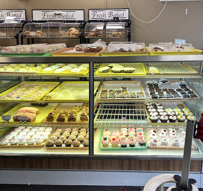 The bakery case – or as I call it, "The Museum of Delicious Art." Each tray holds edible masterpieces more satisfying than anything in the Louvre.