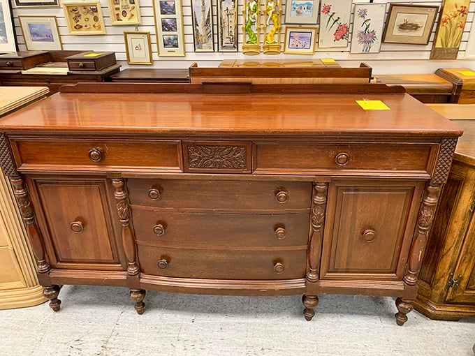 This isn't just a dresser; it's a time machine carved from solid wood when craftsmanship meant something and particle board wasn't invented.