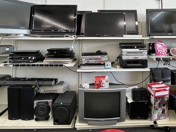 The electronics graveyard or tech resurrection center? One person's outdated equipment is another's vintage gaming night waiting to happen.