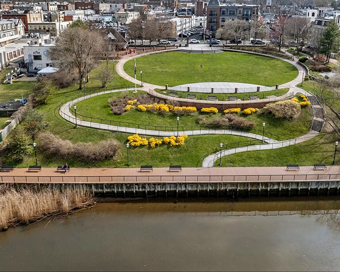 This aerial view reveals Red Bank's clever design—a circular park creating a green heart for the community while embracing the waterfront.