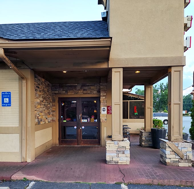 An entrance that promises good things await. Those stone columns aren't just decorative—they're sentinels guarding the gateway to flavor town.
