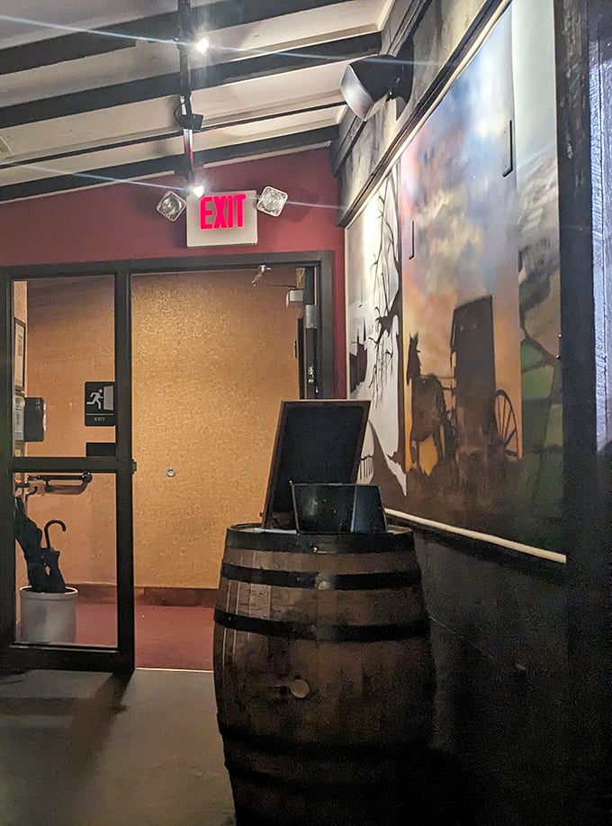 Even the exit has character – a barrel host stand and equestrian artwork remind you this isn't just dinner, it's a fully themed experience.