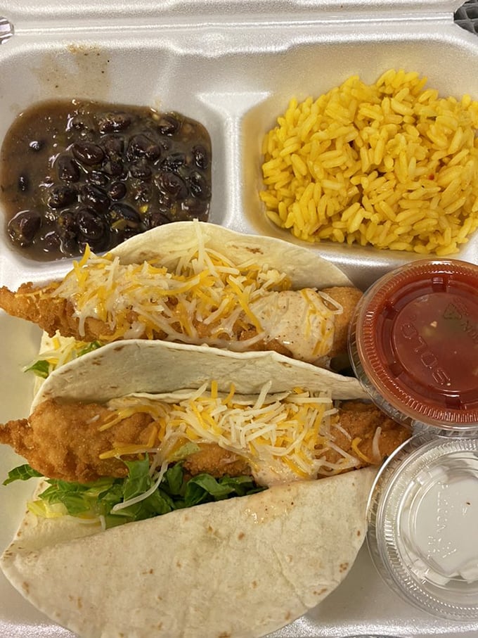 Fish tacos bringing the fiesta to Fort Myers, with yellow rice and black beans as the perfect backup dancers.