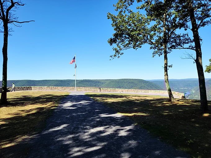 The American flag stands proud against an endless horizon. Some patriotic displays come with natural surround sound and million-dollar backdrops.