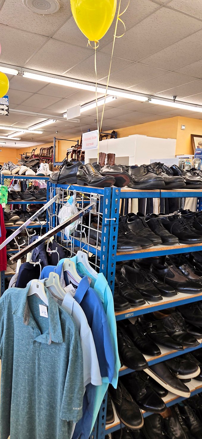 Footwear heaven under yellow balloons—where barely-worn dress shoes and casual kicks find second lives at first-time-buyer prices.