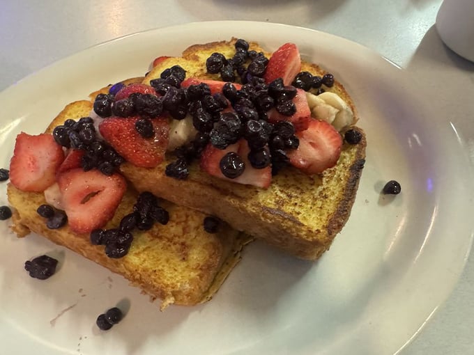 French toast that's dressed for success with fresh berries—proof that sometimes the simplest pleasures are the most extraordinary.