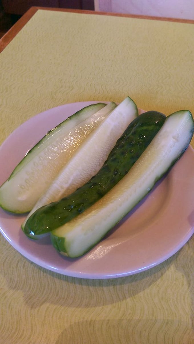 House-made pickles with that perfect garlicky snap. These aren't just cucumbers that took a vinegar bath—they're a deli art form.