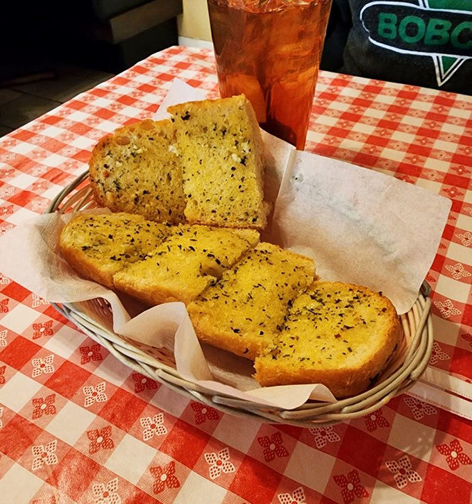 Garlic bread that doesn't whisper its presence—it announces itself with herby, buttery authority. Social distancing from vampires: guaranteed.