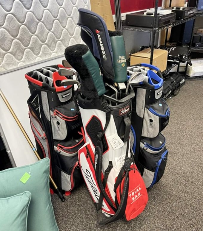 Golf bags lined up like eager caddies—each one containing someone's abandoned dreams of making the PGA tour. Their loss is your fairway gain!