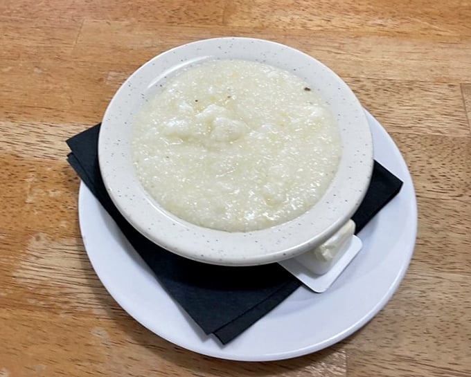 Grits so creamy they could make a Northerner finally understand. This humble bowl contains centuries of Southern breakfast wisdom.