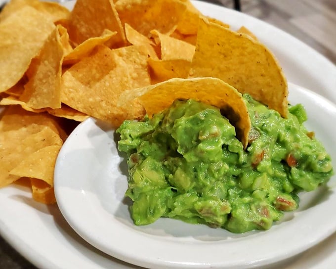 Guacamole so fresh it practically photosynthesizes. These chips are just vehicles for green gold—and willing participants they are.