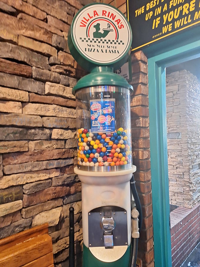 A vintage gumball machine stands guard by the entrance—a sweet sentinel reminding you that childlike joy awaits inside these walls.