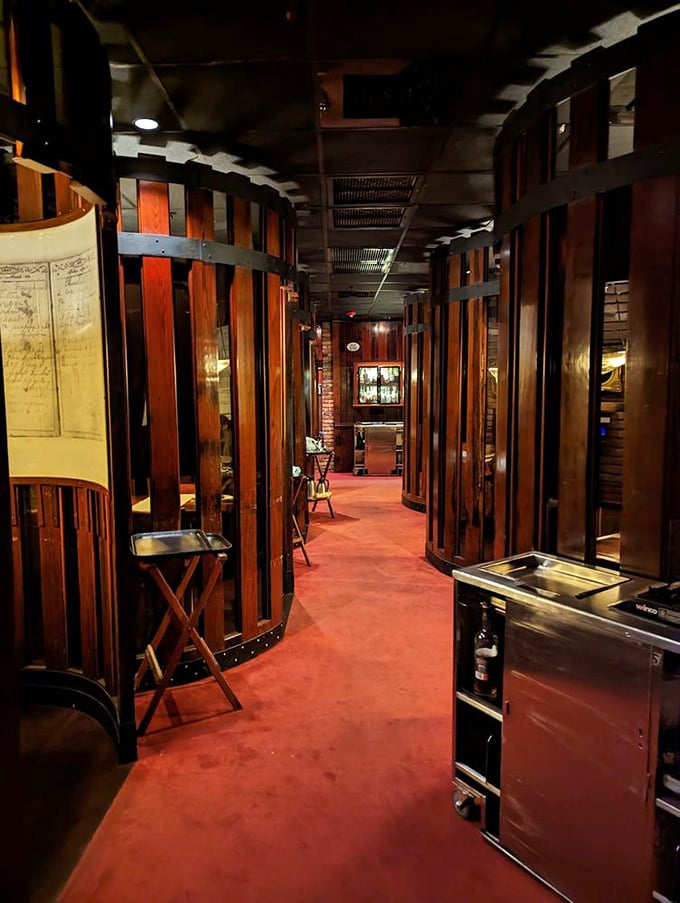 The dessert room's barrel-shaped booths aren't just seating—they're private cocoons of indulgence where sweet endings get their proper respect.