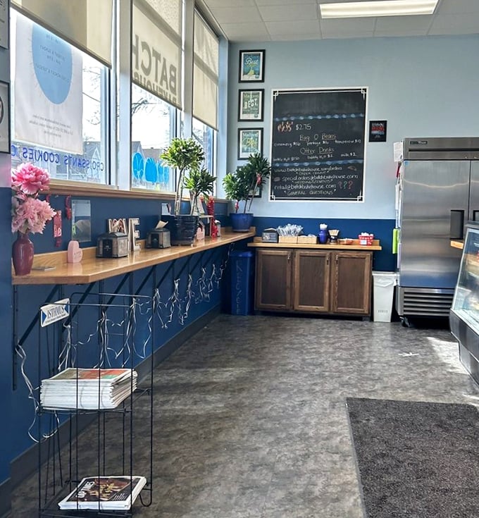 The calm before the pastry storm. Blue walls and wooden accents create the perfect backdrop for serious baked goods contemplation.