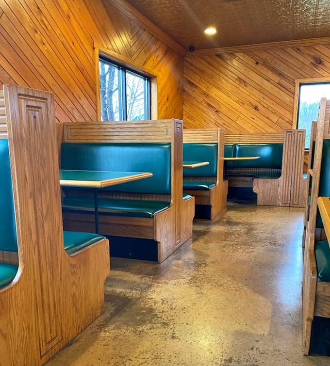 Classic diner-style booths invite you to settle in for serious eating. The wood paneling has absorbed decades of barbecue-scented memories.
