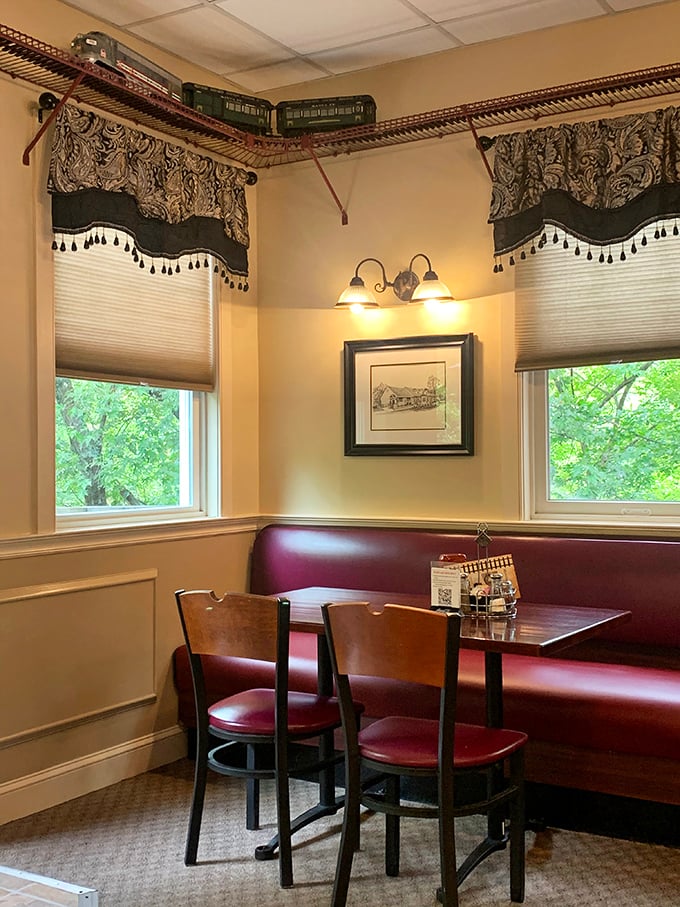 This cozy corner booth beneath the model train track is prime real estate for serious eaters who know the value of a comfortable seat.