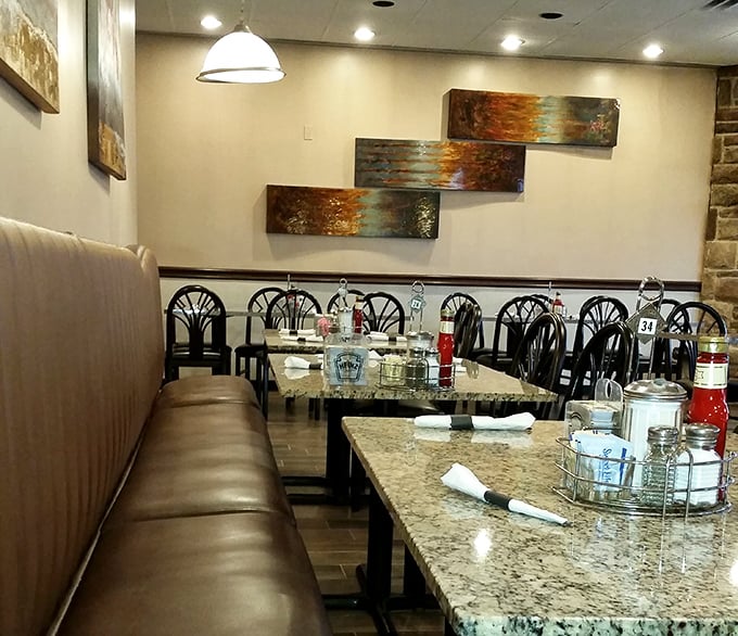 Art that echoes the warm tones of perfectly cooked breakfast foods adorns walls where diners create their own masterpieces—empty plates.
