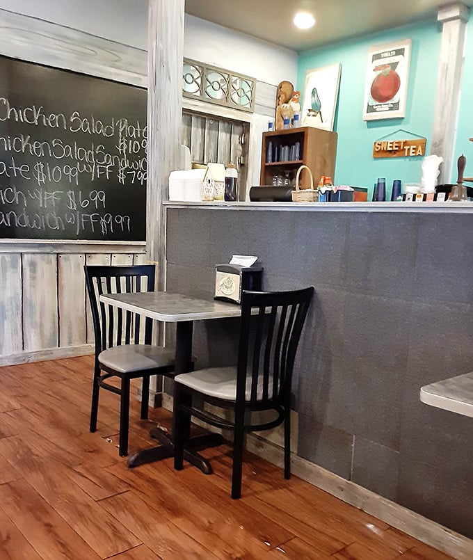 Mint walls, chalkboard specials, and simple furnishings—this corner of the restaurant feels like stepping into a simpler time when food was honest and portions were generous.