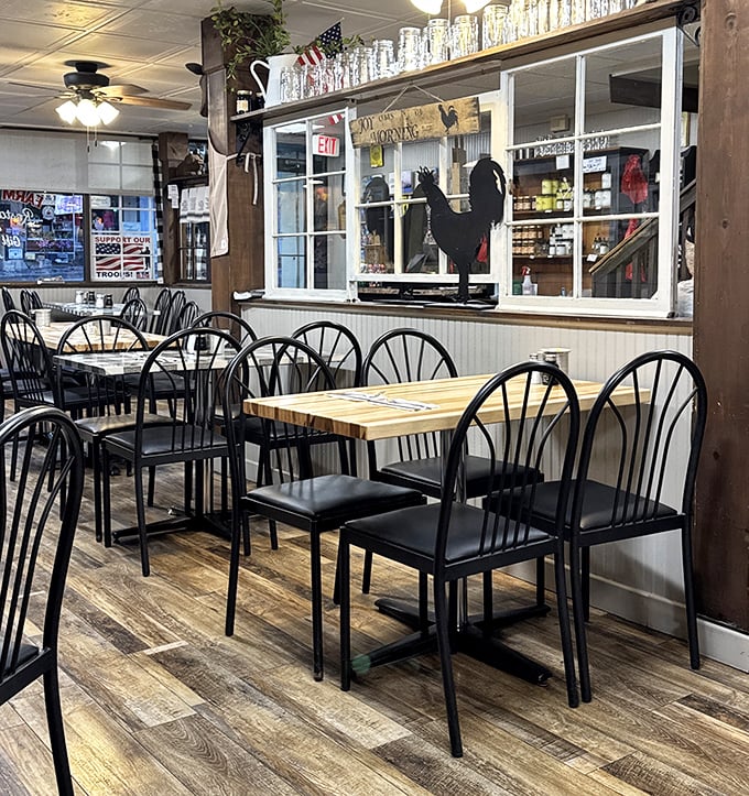 The dining area's simple wooden tables and black chairs create an unpretentious backdrop where the food becomes the undisputed star of the show.