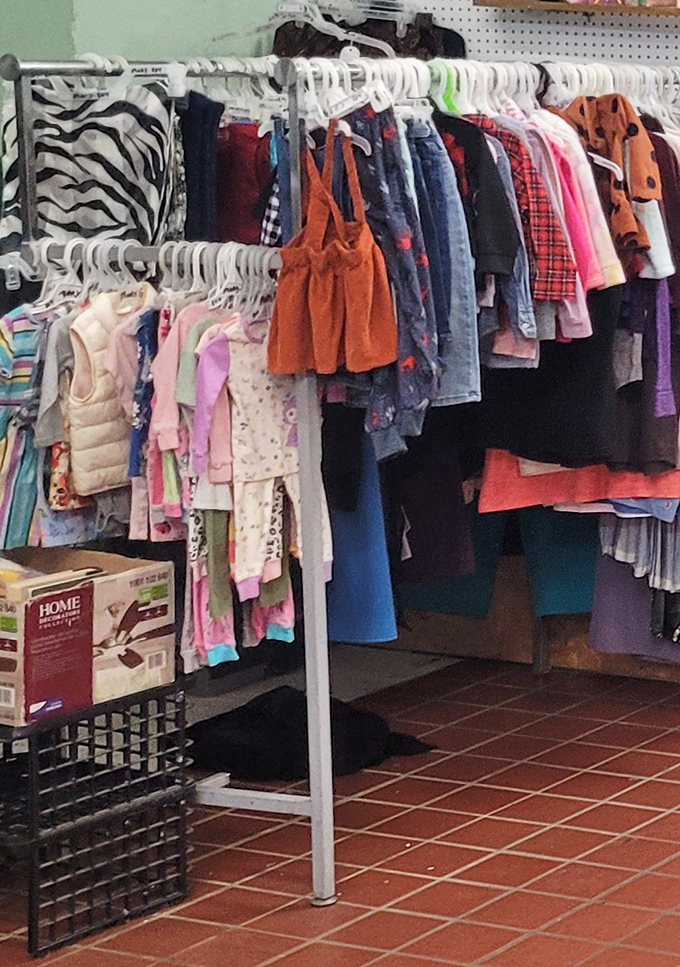 Tiny garments on tiny hangers – each representing a child who outgrew them too quickly, now waiting for their next adventure.