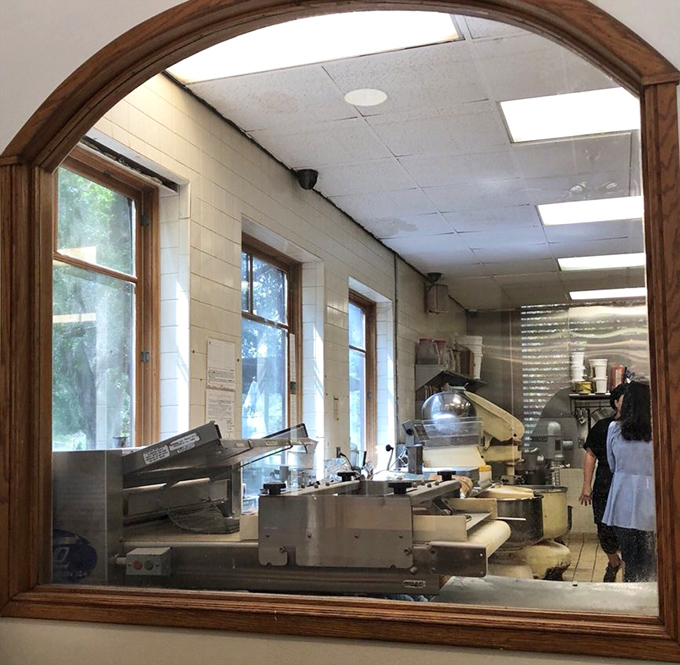 Through this window, you can witness the ballet of bakers at work, transforming simple ingredients into edible masterpieces with practiced precision.