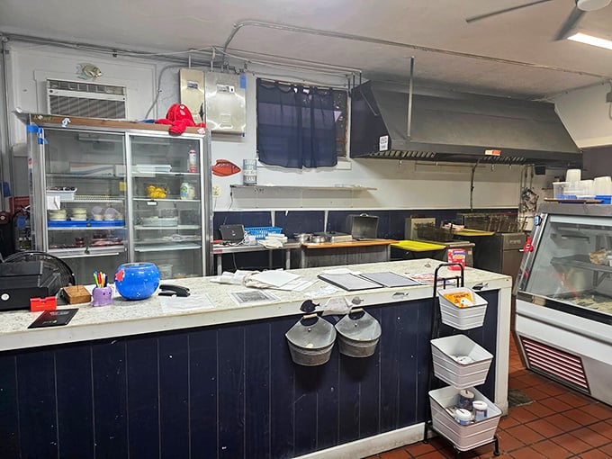 The kitchen – humble command center where seafood magic happens. No fancy gadgets, just skill and fresh ingredients creating memories on plates.