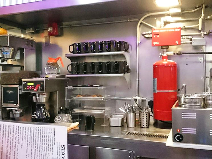The coffee station—command central for morning revival. Those blue mugs stand ready for duty like caffeinated soldiers awaiting their marching orders.