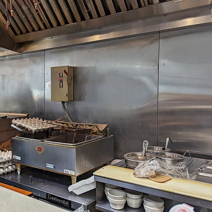 The kitchen – where breakfast dreams come true. No fancy equipment, just decades of experience and the tools to make perfect diner fare.