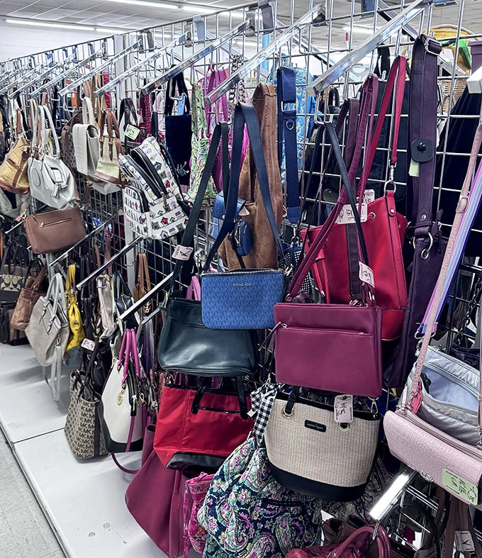 Handbag heaven—designer dreams and practical purses hanging like colorful fruit, ripe for the picking at a fraction of their original price.