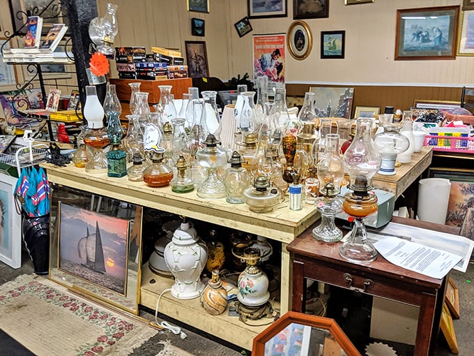 Oil lamps that once illuminated family dinners now light up collectors' eyes. Each glass chimney holds the warm glow of American history.