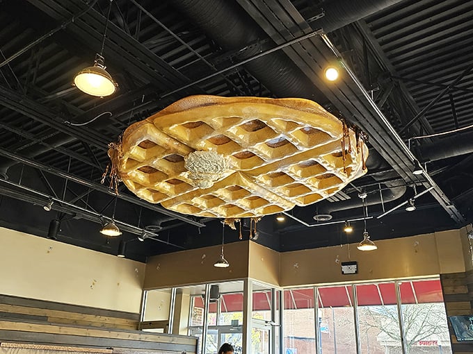 The giant waffle chandelier hanging from the ceiling – because subtle décor is for restaurants that don't understand commitment.