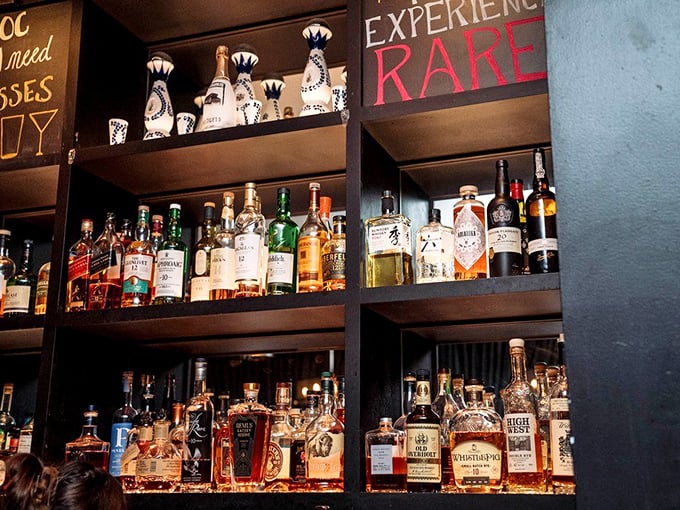 Behind those bottles is liquid happiness waiting to happen. The "Experience Rare" sign isn't just decoration—it's a promise.