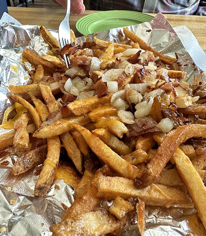 These loaded fries aren't just a side dish—they're a main event with enough cheese, bacon and onion to make a potato proud.