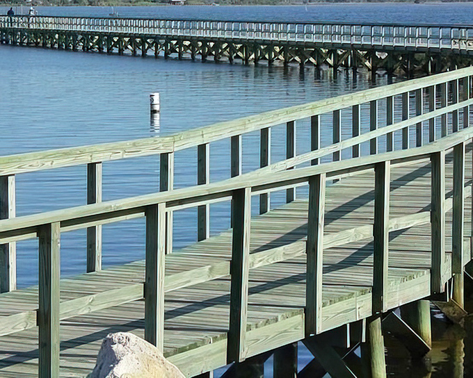 A boardwalk that promises adventure at its end – or at least the perfect spot to watch the sunset paint the sky.