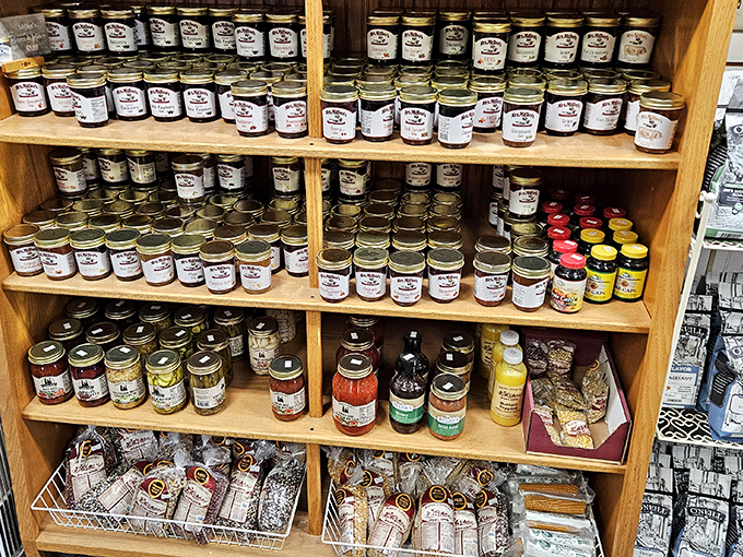 The jam and jelly section could make a minimalist break out in hives—shelves stocked with enough preserved fruit to survive any apocalypse in sweet style.