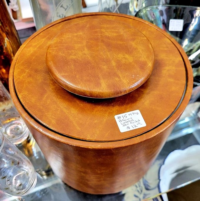 Mid-century ice bucket with leather detailing—because even in the 1960s, cocktail hour demanded proper accessories.