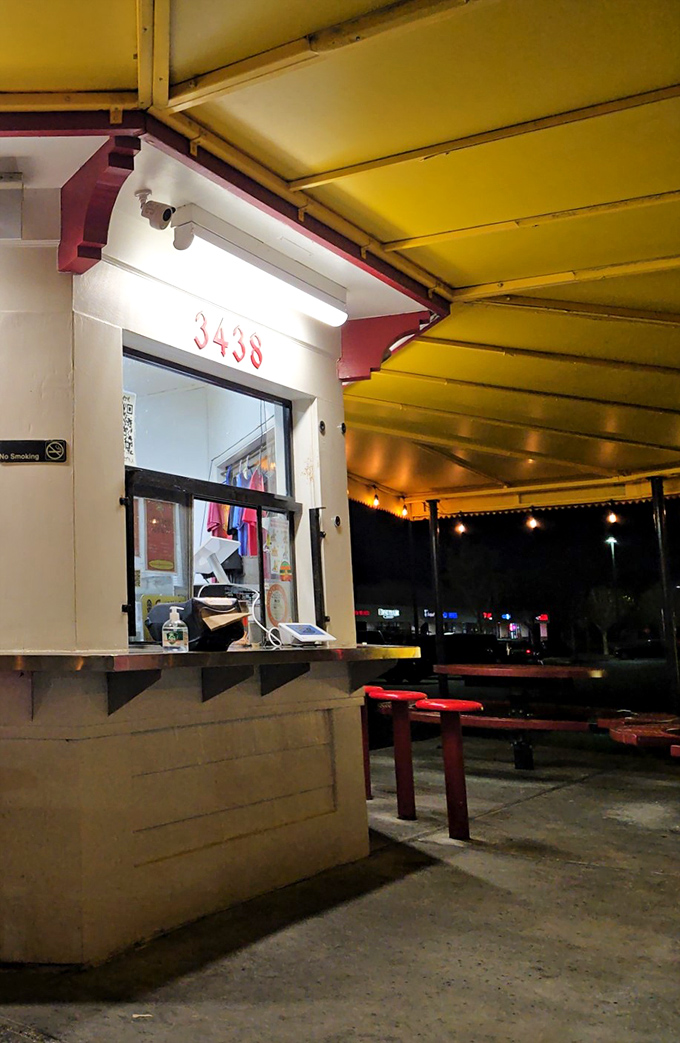 Nighttime at the order counter—where dreams and hunger meet under the gentle glow of fluorescent lighting.