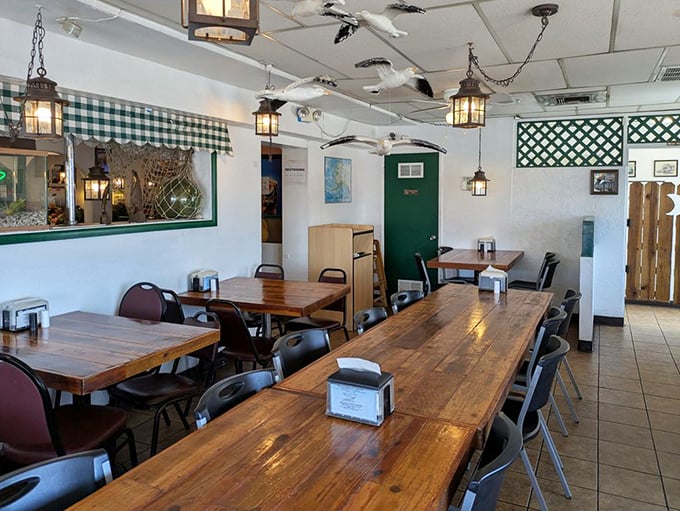 Wooden tables worn smooth by decades of satisfied diners. The hanging lanterns cast just enough light to make your seafood look even more appetizing.