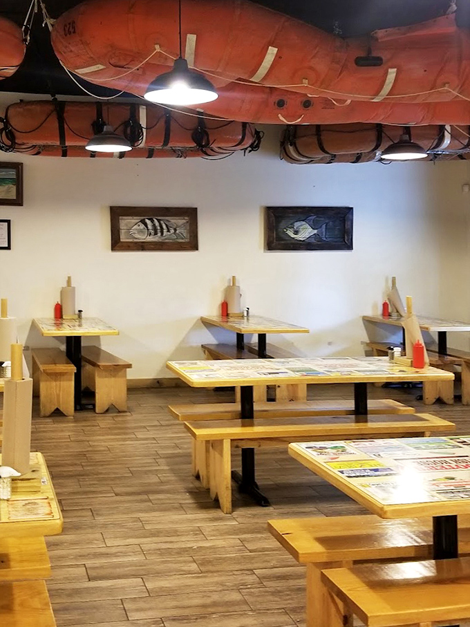 Another dining room view where fishing memorabilia isn't decoration—it's a visual appetizer preparing you for the feast to come.