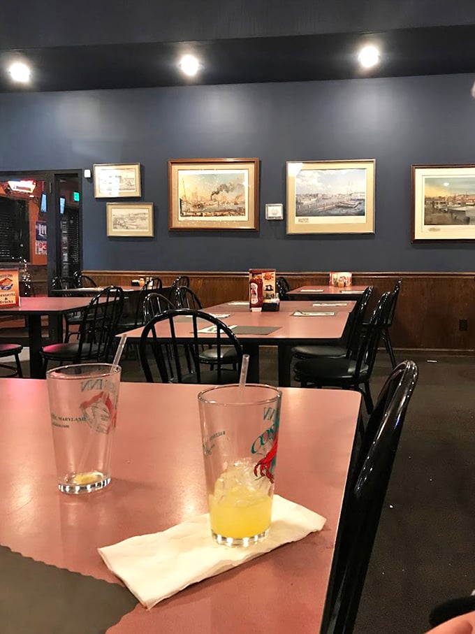 Maritime artwork adorns navy blue walls while Orange Crushes await – a dining room that feels like Baltimore's living room.