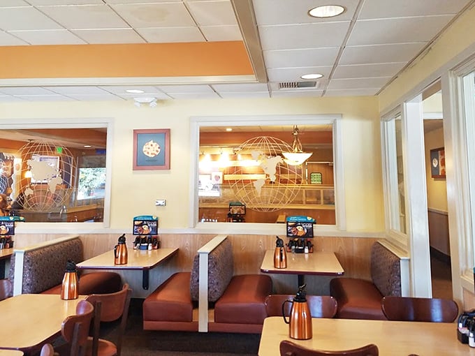 Cozy booths and warm lighting create the perfect backdrop for morning conversations or peaceful solo dining. No filter needed.