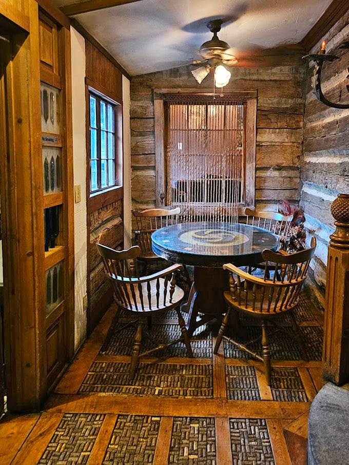 Intimate dining nooks carved from history – where Windsor chairs and exposed log walls create the perfect setting for memorable conversations.