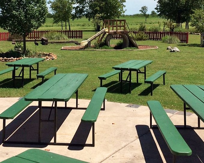 Where kids play while adults contemplate a second helping of catfish. This outdoor space turns a meal into an afternoon escape from reality.