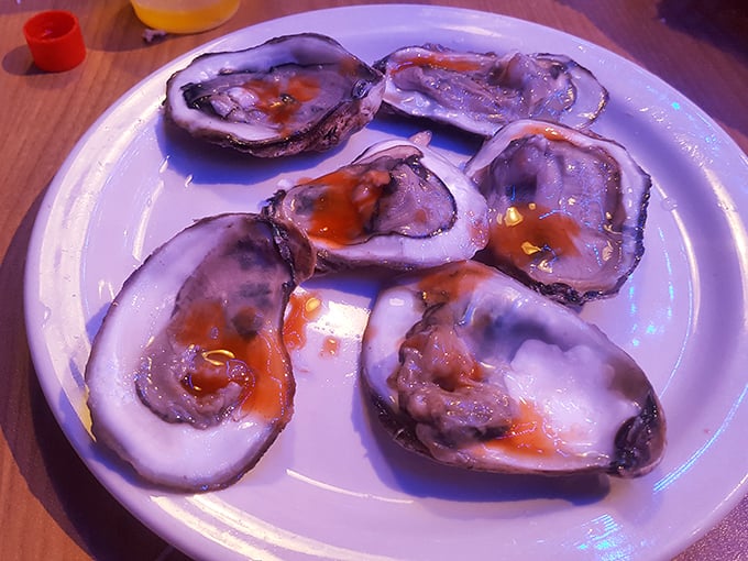 Fresh oysters with a splash of hot sauce—nature's perfect appetizer and proof that sometimes the best things in life require just a little bit of courage.
