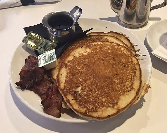 Pancakes so fluffy they could float away if not anchored by that crispy bacon—breakfast as it was meant to be.