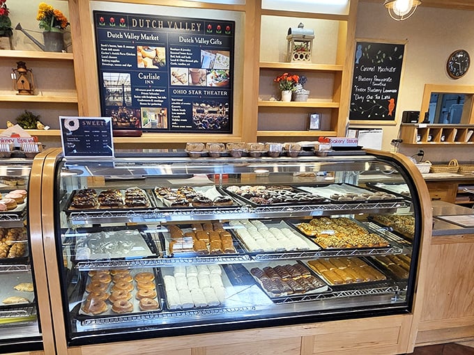 The bakery case—where diet plans go to die and "I'll just have a small piece" becomes the lie you tell yourself.