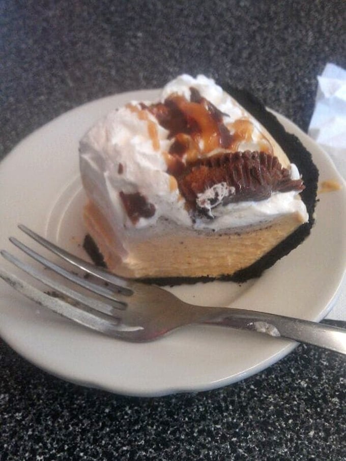 A slice of cream pie that doesn't need Instagram filters or fancy plating—just honest-to-goodness layers of crust, filling, and whipped cream that taste like childhood.