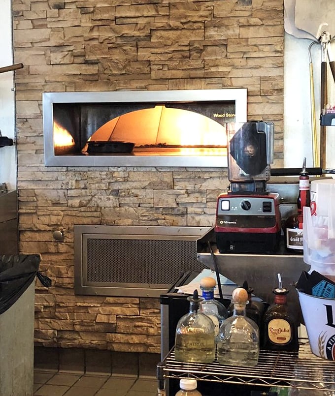 The brick oven where pizza dreams come true – proof that seafood restaurants can excel at unexpected culinary plot twists.